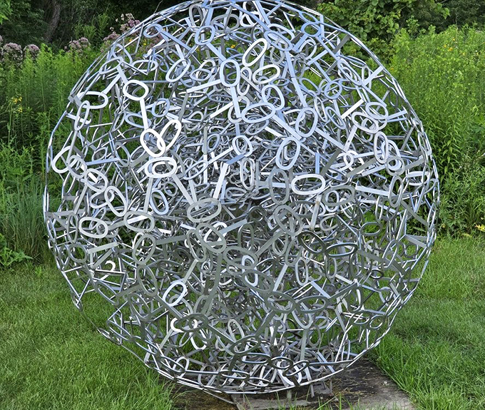 Like a metallic thought bubble frozen in mid-explosion, this spherical sculpture captures the moment when ideas burst into being.
