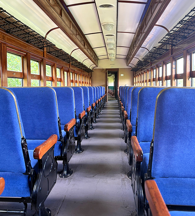 Step inside and travel back in time with these vintage blue seats and polished wooden details&mdash;first-class accommodations for your journey to yesteryear.
