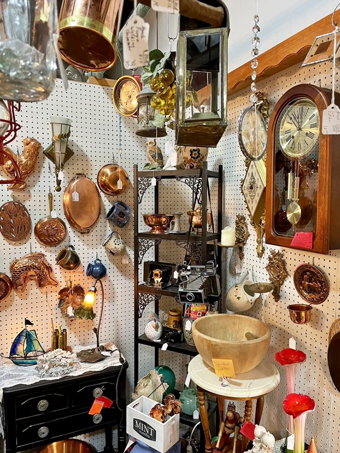 A collector's paradise where copper molds, vintage clocks, and wooden bowls create a time-traveler's dream. Every pegboard inch tells a different story.