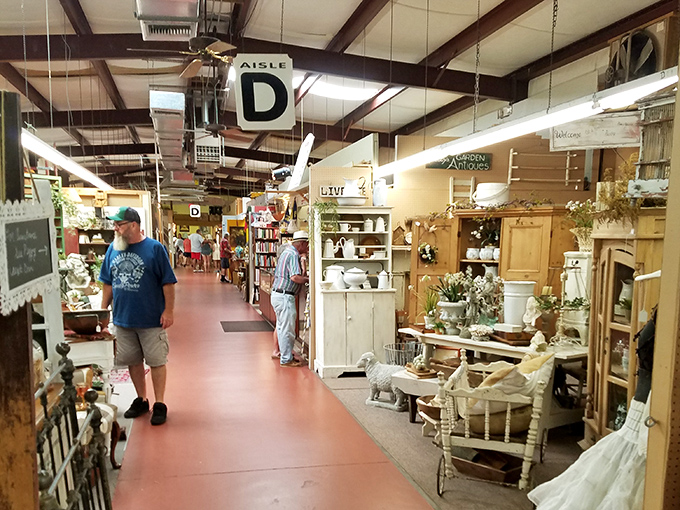 The antique center's organized chaos reveals itself in neat aisles where shoppers can browse everything from farmhouse chic to mid-century modern treasures.