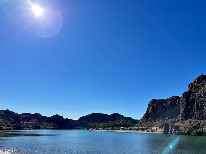 Blue skies, bluer water, and mountains that look like they were painted by a particularly ambitious artist.