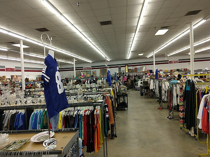 Aisles that seem to extend into infinity, each rack a potential goldmine of fashion finds from decades past.