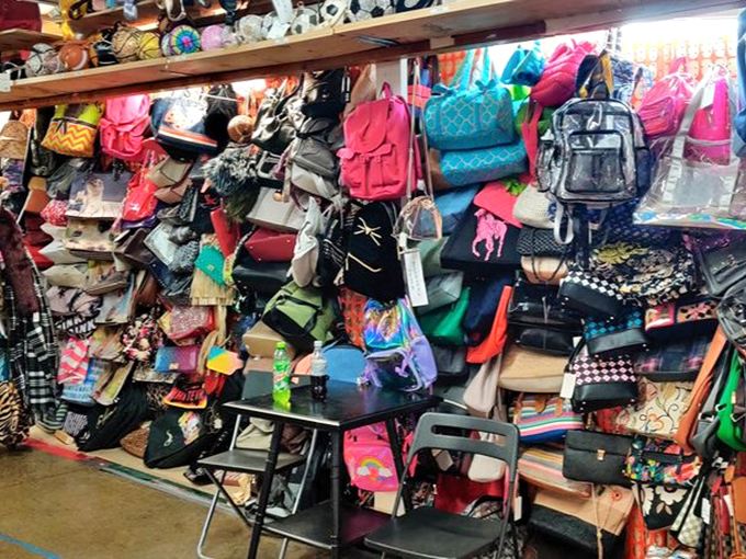 A kaleidoscope of handbags and backpacks creates a textile tapestry that would make any accessory enthusiast weak in the knees.