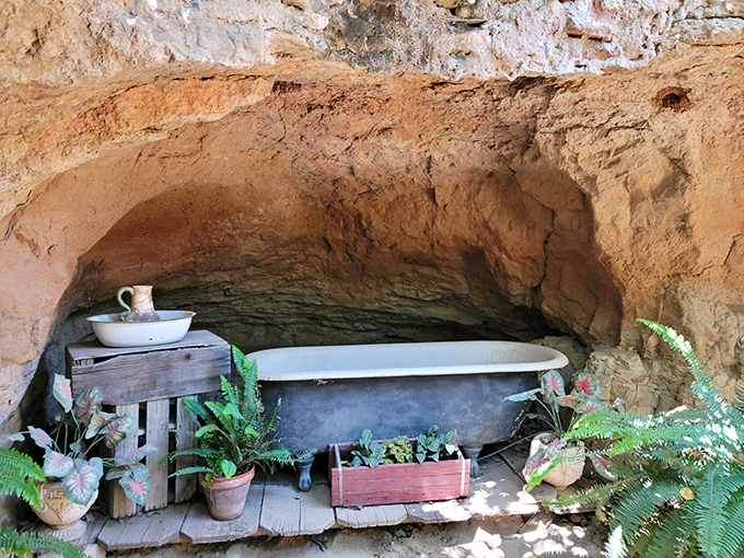 Even underground dwellers need a good soak! This vintage bathtub nestled in its earthy alcove proves luxury can exist anywhere with enough imagination.