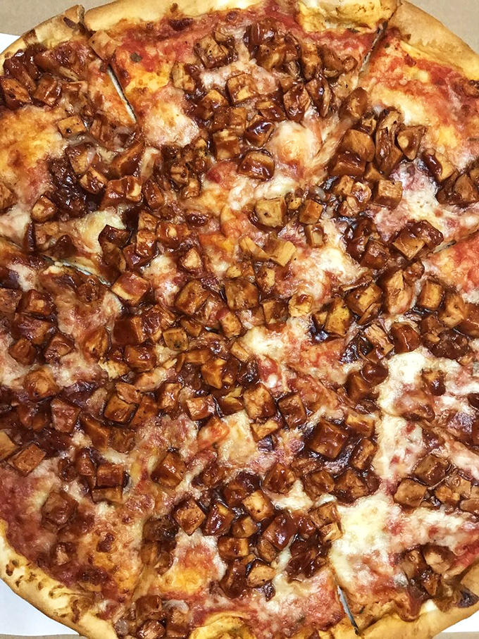 BBQ chicken pizza perfection! Each glazed chunk of chicken is a sweet-savory island in a sea of melted cheese. Worth every mile of the journey.