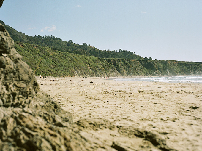 Where the Santa Lucia Mountains meet the sea, creating a golden crescent that feels like California's best-kept secret.