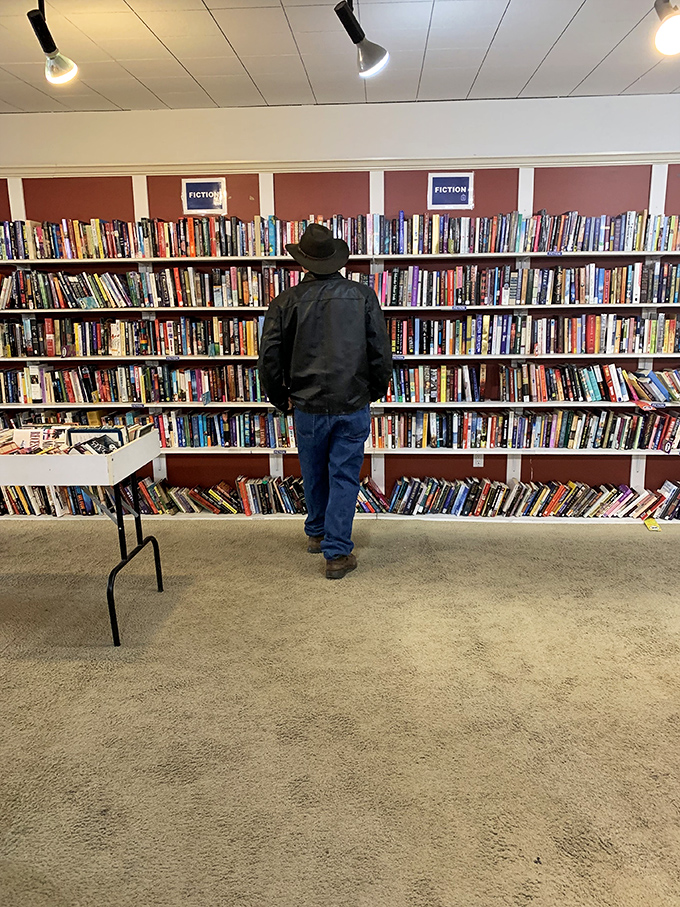The book section rivals small-town libraries, with fiction titles organized alphabetically. Bibliophiles could spend hours here hunting literary treasures.