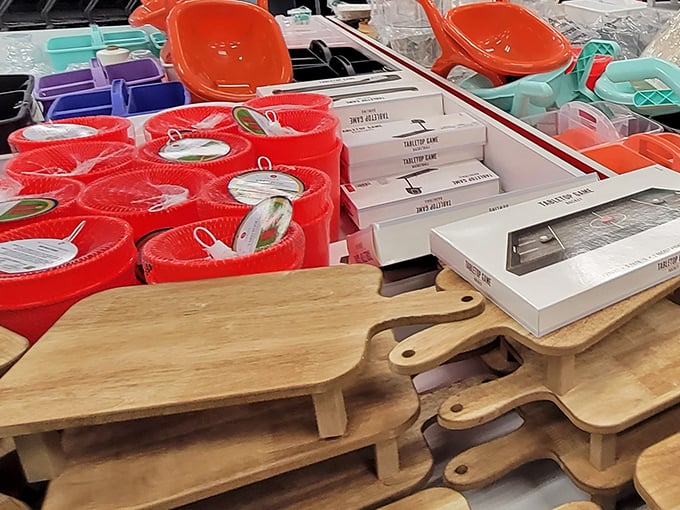 Wooden cutting boards and colorful containers await new kitchens. That stack of pine boards isn't just kitchen equipment&mdash;it's a dinner party waiting to happen at one-third the usual cost.