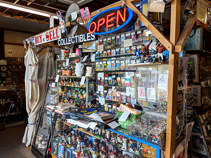 A collector's paradise where nostalgia meets commerce. This booth's glass cases protect decades of memories and miniature treasures.