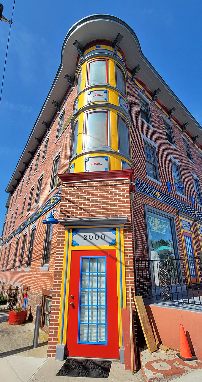 The museum's distinctive corner entrance with its vibrant primary colors hints at the whimsical world waiting inside.