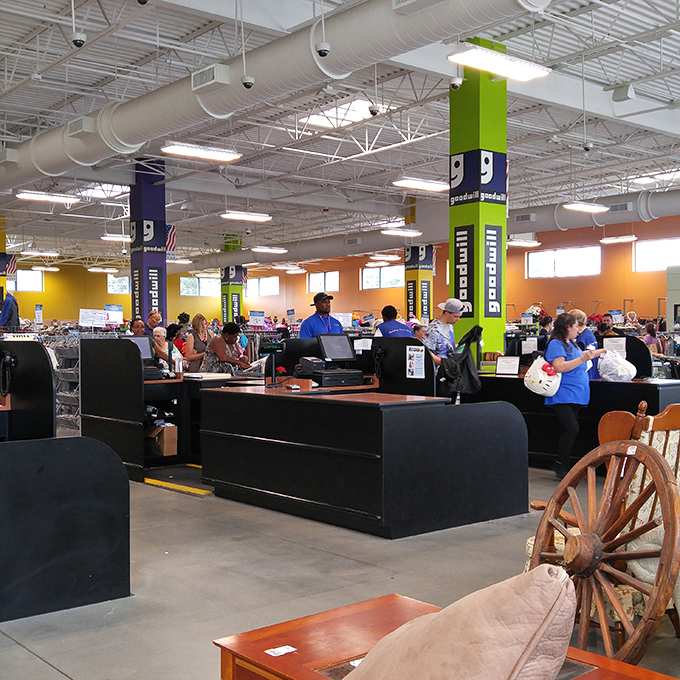 The checkout area buzzes with the quiet electricity of victory as shoppers clutch their finds, each face wearing that unmistakable "scored-a-deal" glow.