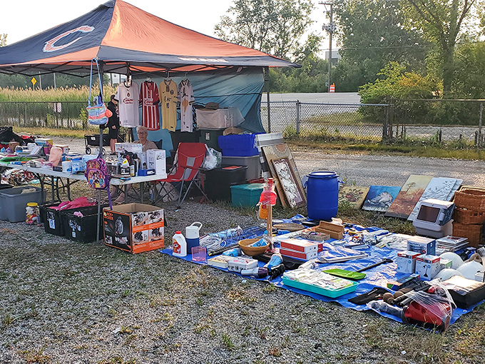 One vendor's carefully arranged chaos is another shopper's treasure map &ndash; notice the vintage frames and toy fire truck waiting for their forever homes.