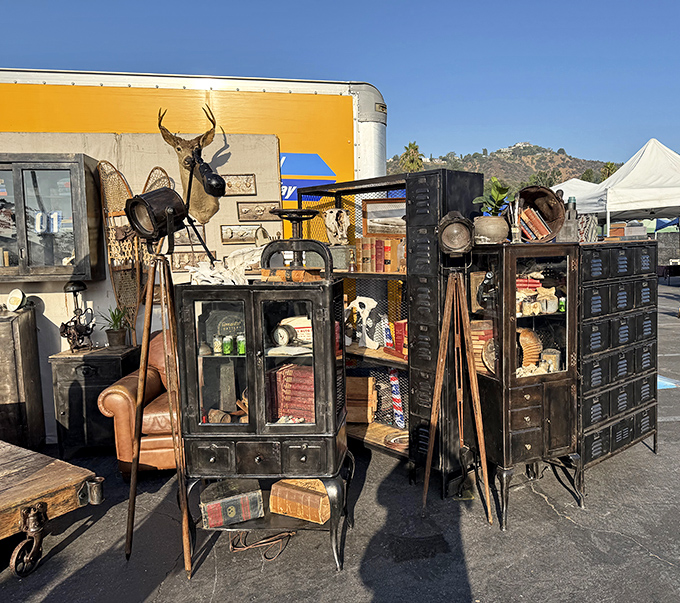 Mid-century furniture heaven! This booth looks like Don Draper's garage sale, complete with that taxidermy deer judging your decorating choices.