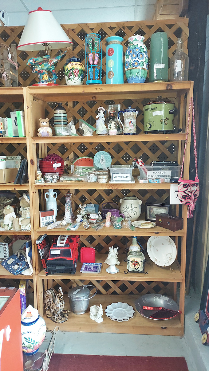 Each wooden shelf tells a different tale, with colorful ceramics and figurines waiting patiently for their next chapter to begin.