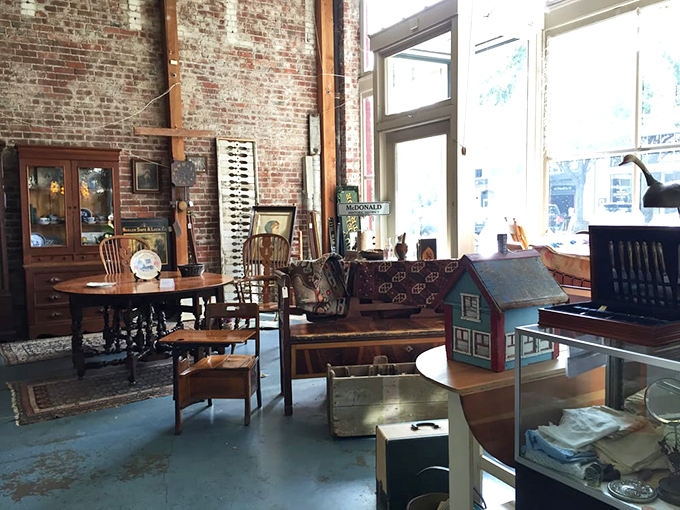 Exposed brick walls create the perfect backdrop for antique furniture and collectibles. History doesn't just sit here&mdash;it invites you in.