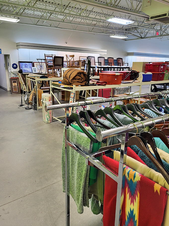 Racks upon racks of possibility! From colorful textiles to furniture finds, each aisle promises its own adventure in secondhand discovery.