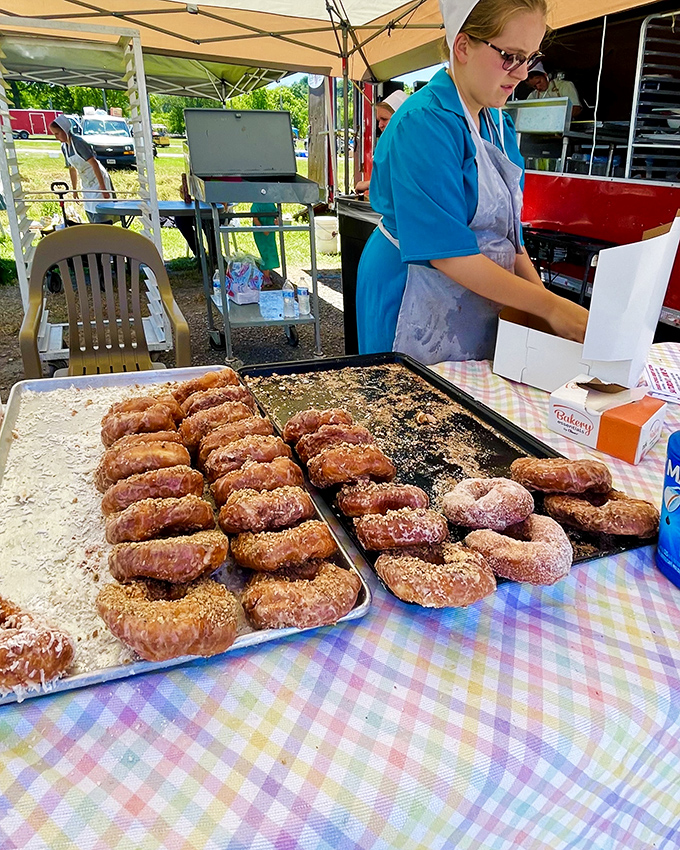 The donut dilemma: choosing which sugary masterpiece to devour first while the aroma of fresh-fried dough tests your willpower.