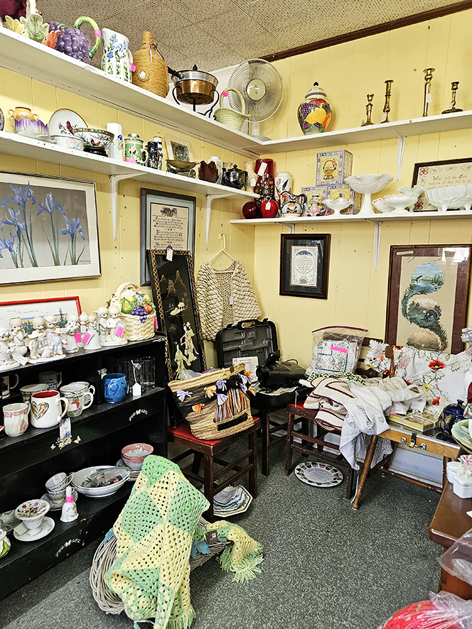 Every shelf tells a story in this yellow-walled booth. That crocheted throw has probably witnessed more history than most history books.