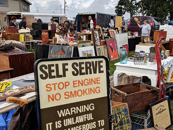 Every picture tells a story, especially when surrounded by vintage wooden crates and weathered signs. One person's garage art becomes another's living room centerpiece.