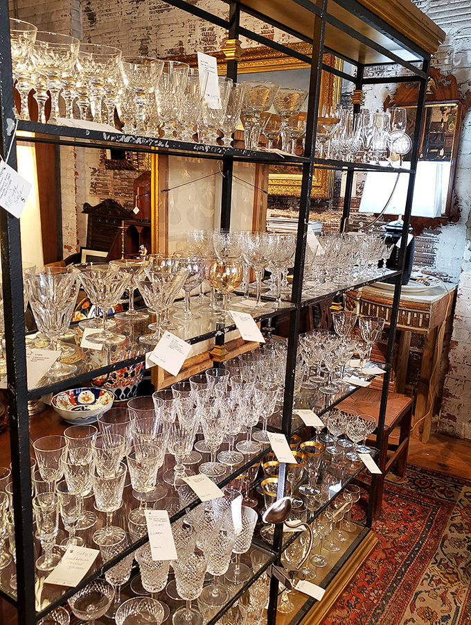 Crystal kingdom! This dazzling collection of glassware catches light like diamonds, each piece whispering of champagne toasts and elegant dinner parties past.