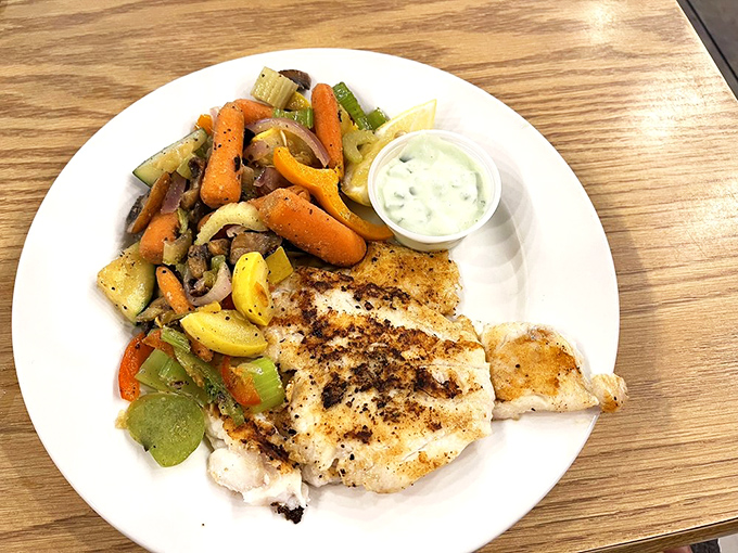 Perfectly grilled fish meets colorful vegetables in a plate that screams "Florida sunshine." This isn't just dinner&mdash;it's edible artwork with a side of tartar sauce.