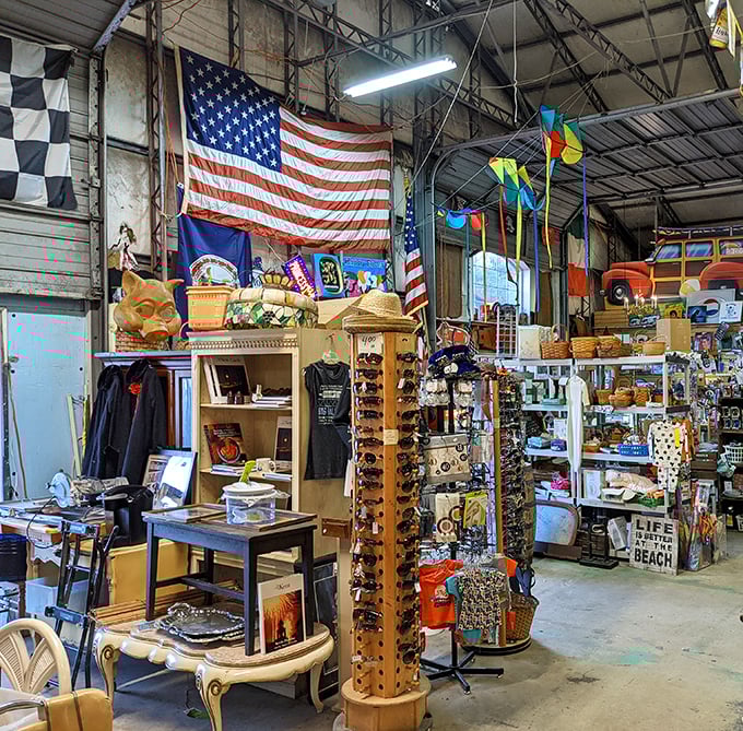 The American flag stands sentinel over this corner of collectibles, where patriotism meets nostalgia in a delightful jumble.