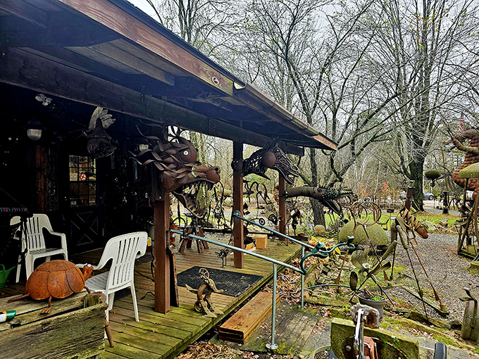 The rustic porch offers a perfect vantage point to admire the menagerie of metal creatures populating this whimsical outdoor museum.
