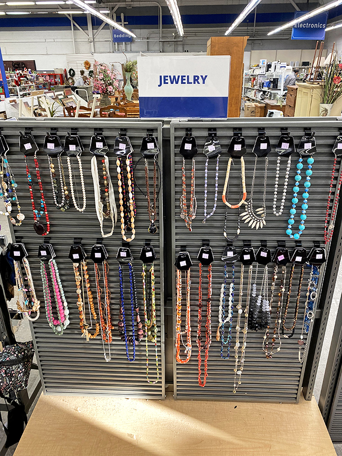 Jewelry display that proves one person's "last season" is another's "just discovered vintage." These colorful strands are waiting for their second act.