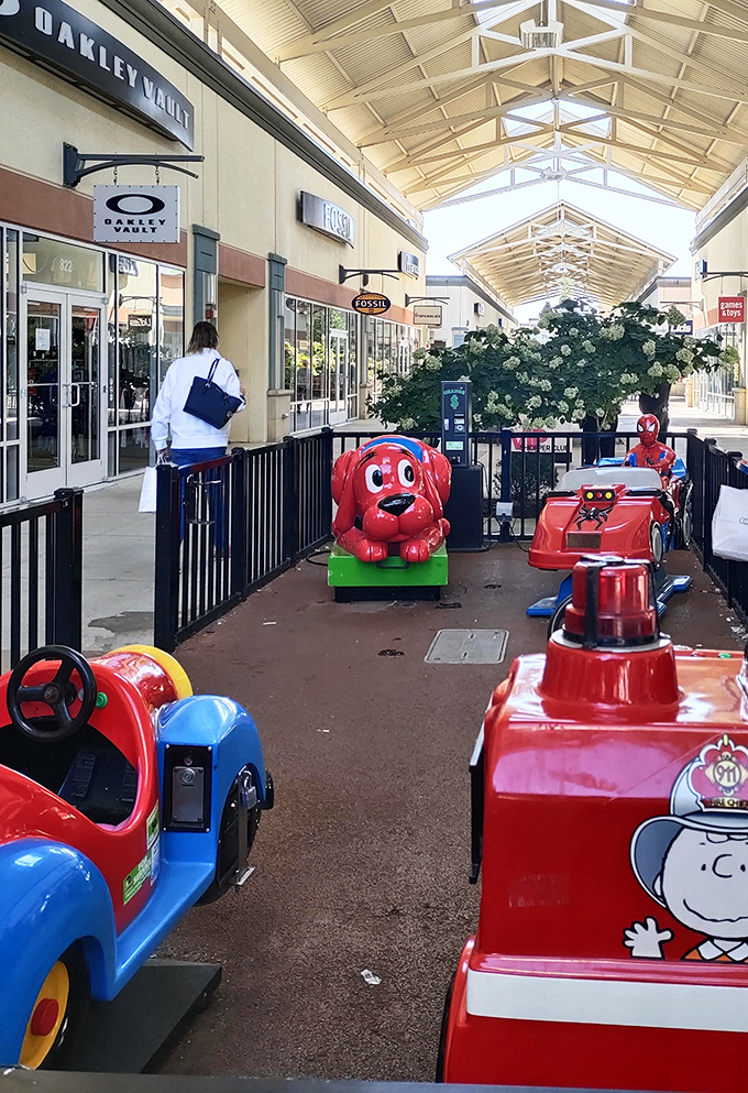 Kid-friendly ride-on attractions strategically placed between stores&mdash;because nothing says "I can shop longer" like happy, occupied children.