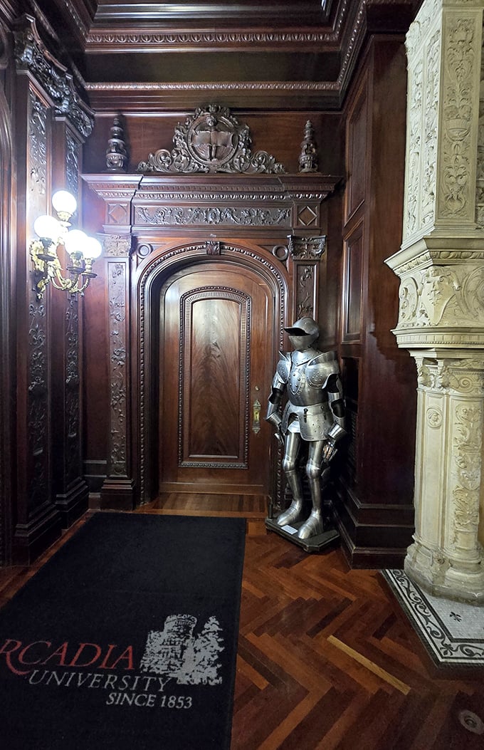 This silent knight stands eternal guard beside intricately carved doorways. No dragons to slay here, just architectural details that would make any medieval craftsman proud.