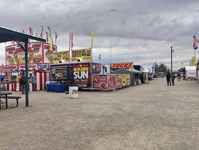 Food vendors line the dusty pathways, promising everything from "Golden Sun" delights to sock shopping&mdash;because who doesn't need both?