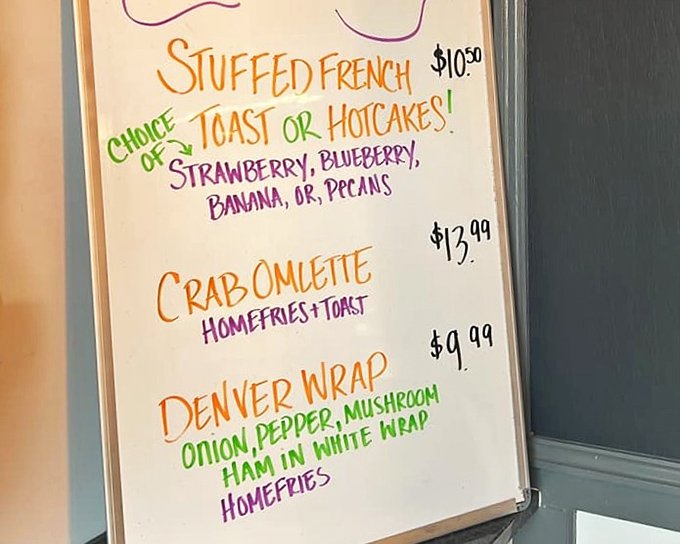 This colorful menu board is like a treasure map where X marks the stuffed French toast. The Denver Wrap whispers sweet nothings to savory breakfast lovers.