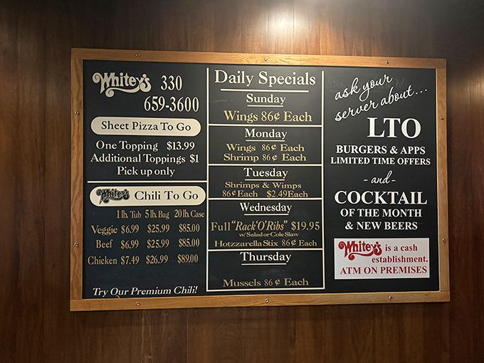 This menu board tells you everything you need to know: daily specials, sheet pizza, and premium chili. No pretension, just possibilities.