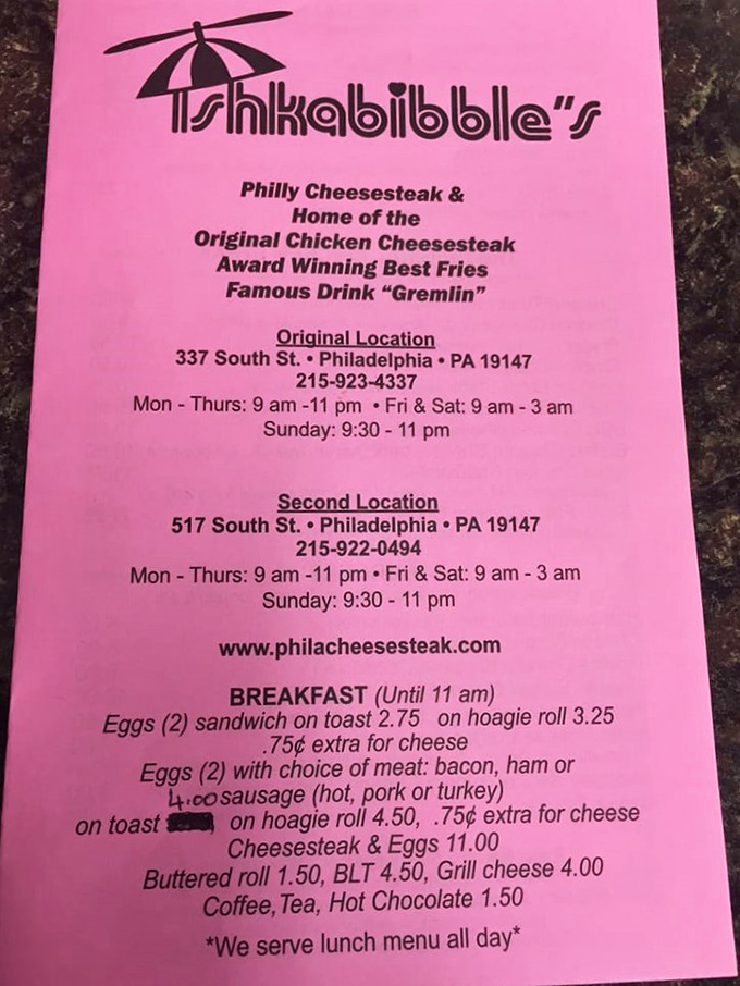 The pink menu tells you everything you need to know: chicken cheesesteak, Philly cheesesteak, and that mysterious "Gremlin" drink.
