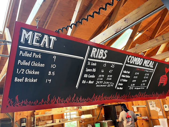 The menu board's flame border tells you everything: this place takes its fire as seriously as a dragon with heartburn.