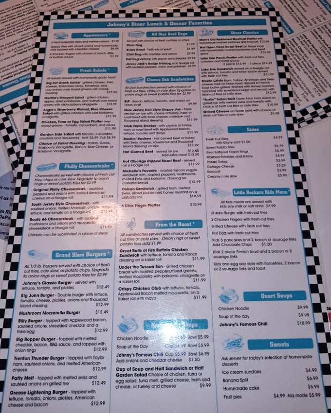 The menu at Johnny's reads like a love letter to American classics. Each laminated page promises satisfaction that chain restaurants can only dream of delivering.