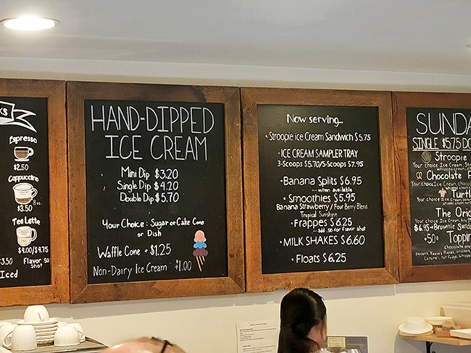 This menu board isn't just listing options&mdash;it's offering life choices. The hand-lettered chalk practically whispers, "Diet tomorrow, indulge today."