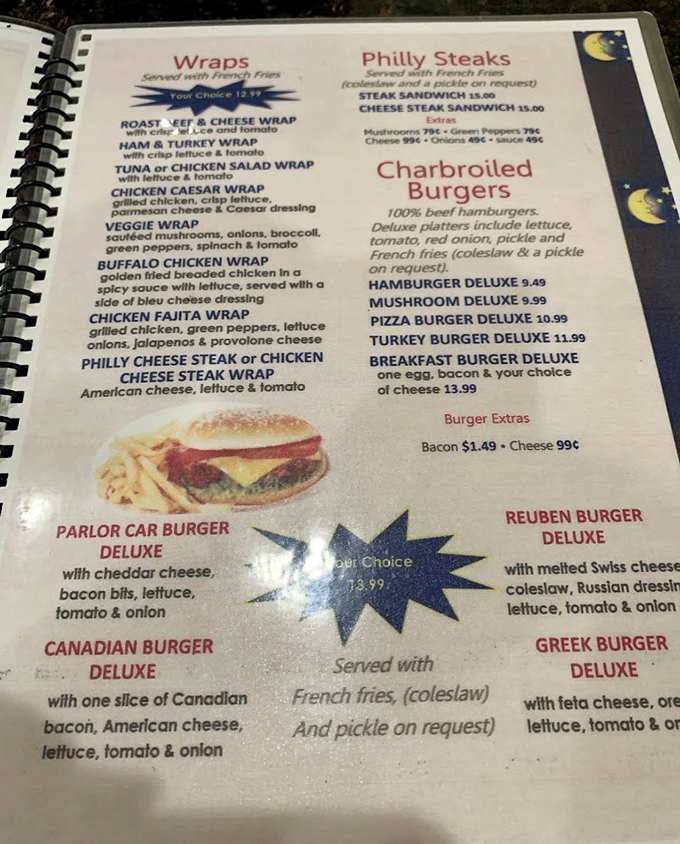 A menu that reads like a love letter to American comfort food, with that iconic blue crescent moon logo watching over breakfast classics and burger creativity.