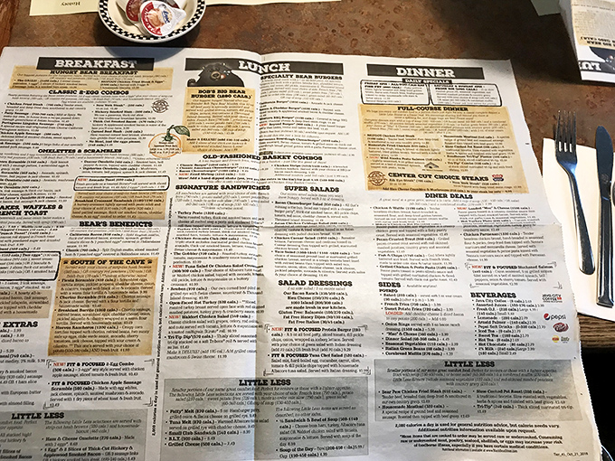 A menu board that reads like poetry to meat lovers. Each chalk-scrawled offering represents hours of patience and wood-fired devotion.