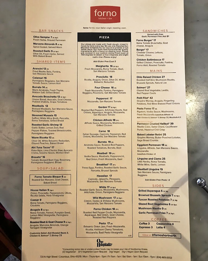 The menu reads like a love letter to Italian cuisine, with wood-fired pizzas taking center stage in this culinary romance story.