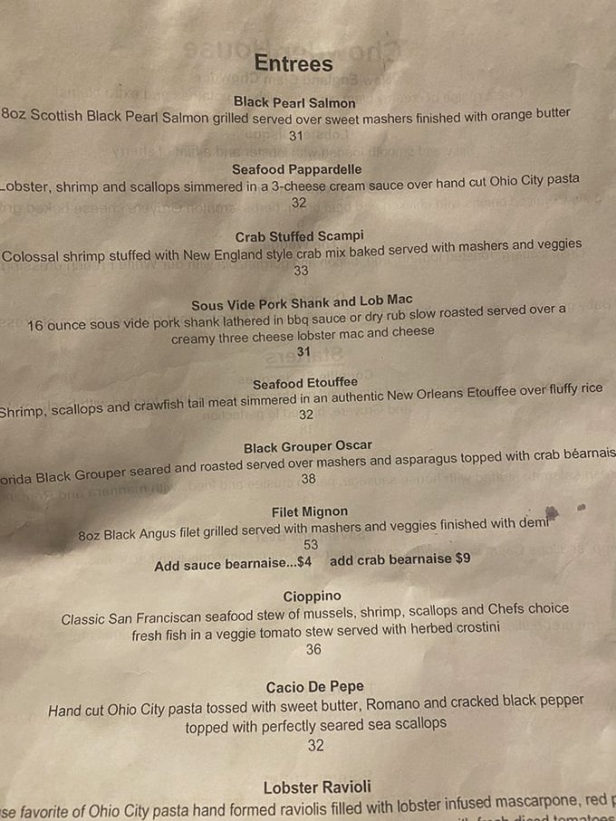 A menu that reads like poetry for seafood lovers. Each description promises a culinary journey that seems improbable this far from any ocean.