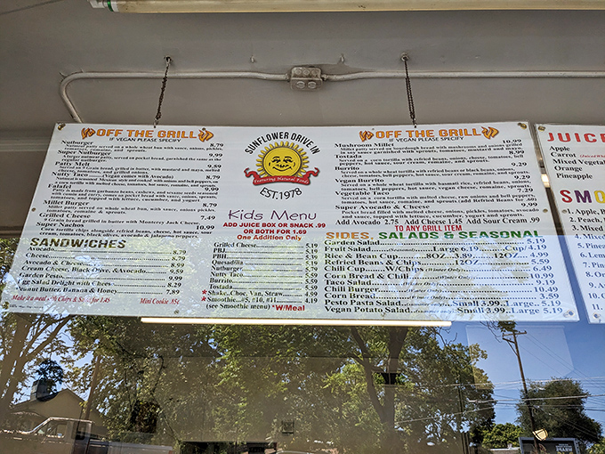 This menu board isn't just a list&mdash;it's a roadmap to happiness. The smiling sun logo promises that even your wallet will leave satisfied.