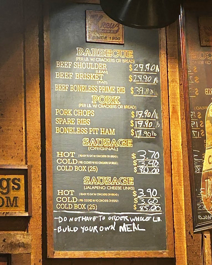 The chalkboard menu at Kreuz&mdash;a minimalist poem to meat. No fancy descriptions needed when your brisket has been speaking for itself for generations.
