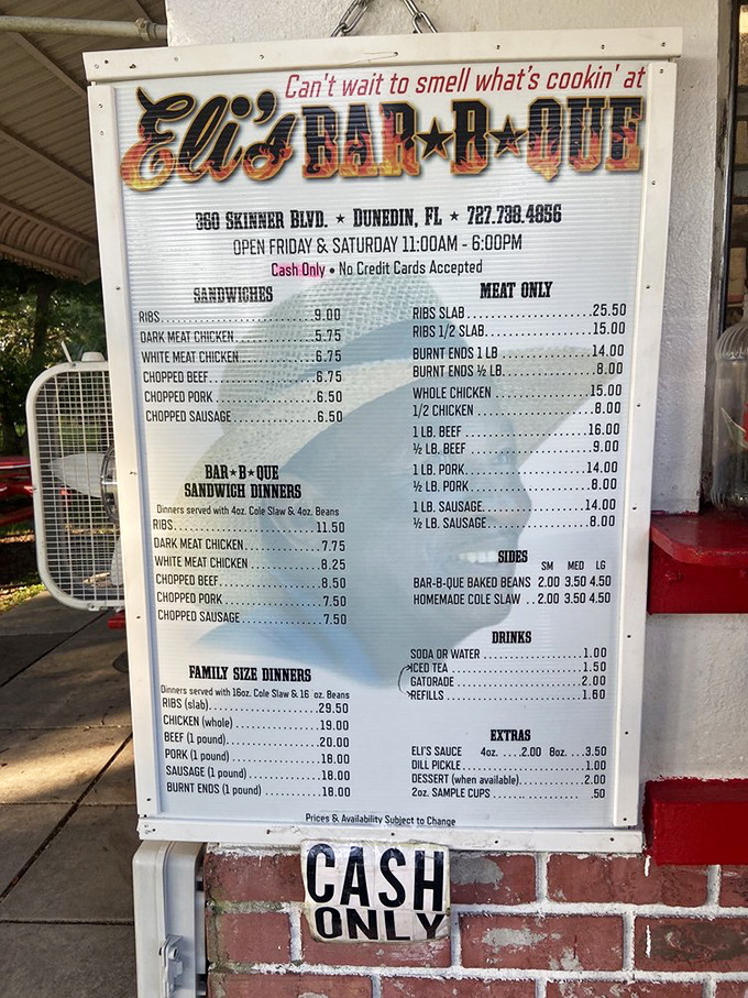 The menu board tells you everything you need to know: cash only, limited hours, and meat that's worth planning your weekend around.