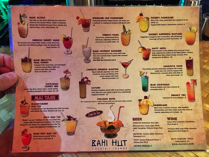 This extensive cocktail menu reads like a passport to tropical paradise, featuring classics and creative concoctions.