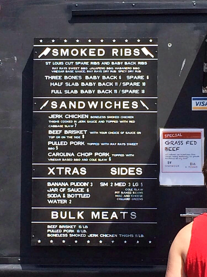 A menu board that cuts straight to the chase&mdash;no flowery descriptions needed when your meat speaks volumes. The star? That jerk chicken calling your name.