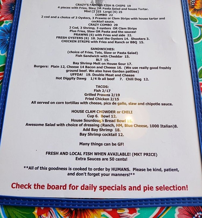 A menu that cuts right to the chase: fresh seafood, no pretense. That note about "cooked by HUMANS" is the kind of honesty we need more of.