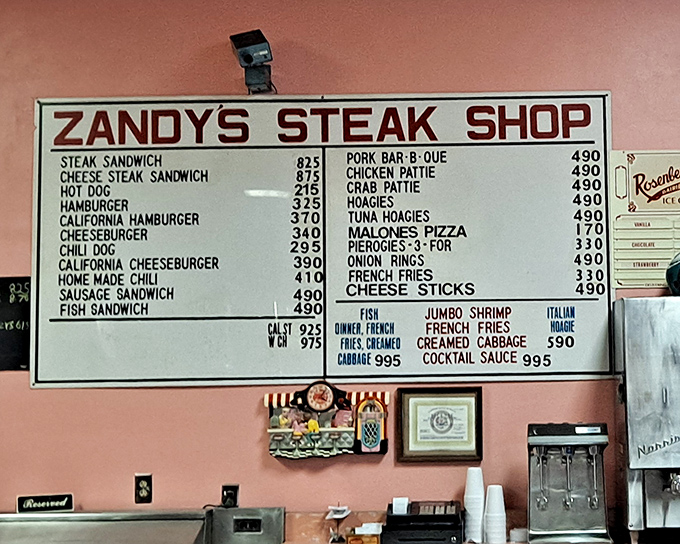A menu board that tells you everything you need to know about life's priorities: cheesesteaks first, everything else second.