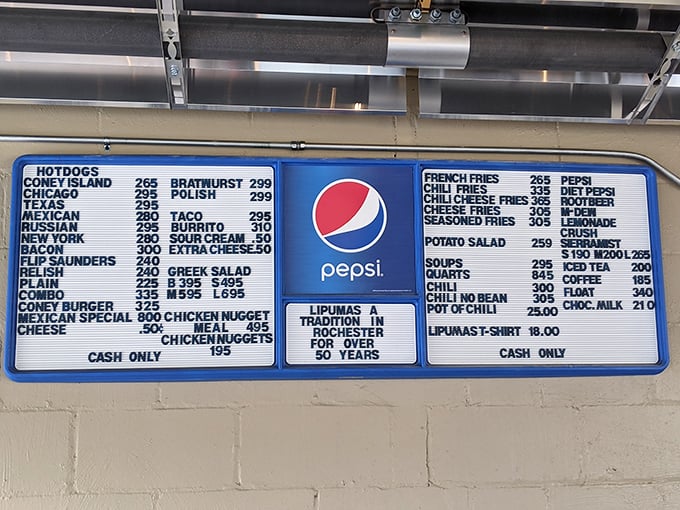 The menu board tells the whole delicious story&mdash;decades of hot dog artistry captured in blue and white, with that "Cash Only" reminder of simpler times.