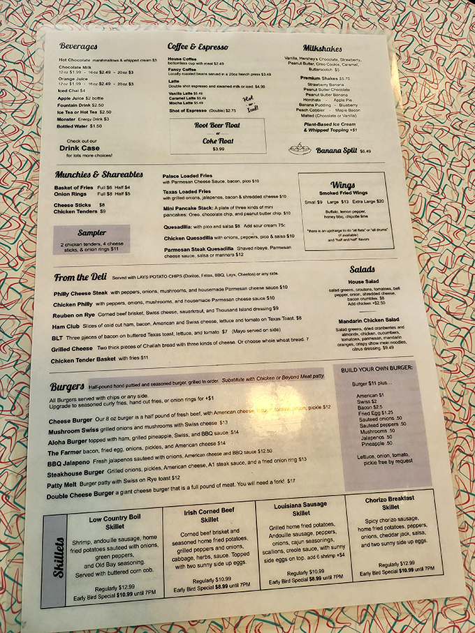 A menu that reads like a love letter to American comfort food. Each laminated page promises satisfaction that no fancy restaurant with unpronounceable ingredients could deliver.